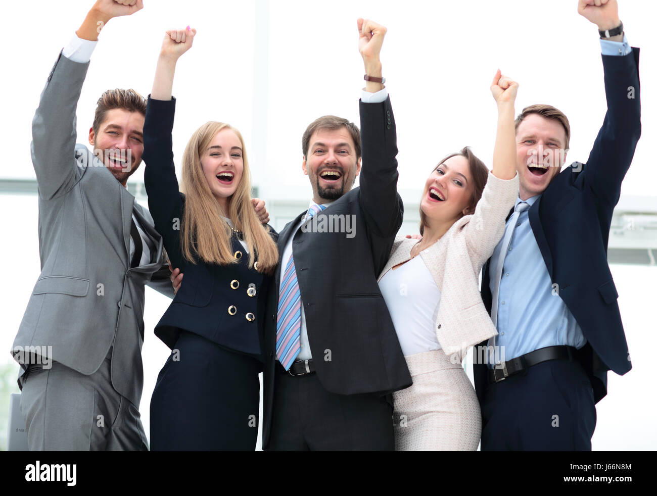 Successful and confident business team celebrating win Stock Photo - Alamy