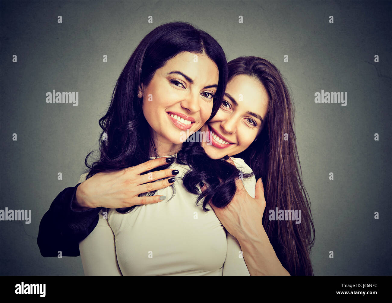 Two black women hugging each other hi-res stock photography and images ...