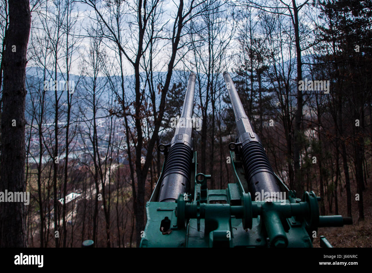 War artillery, tank shelling in the position of town, tube pointing ...