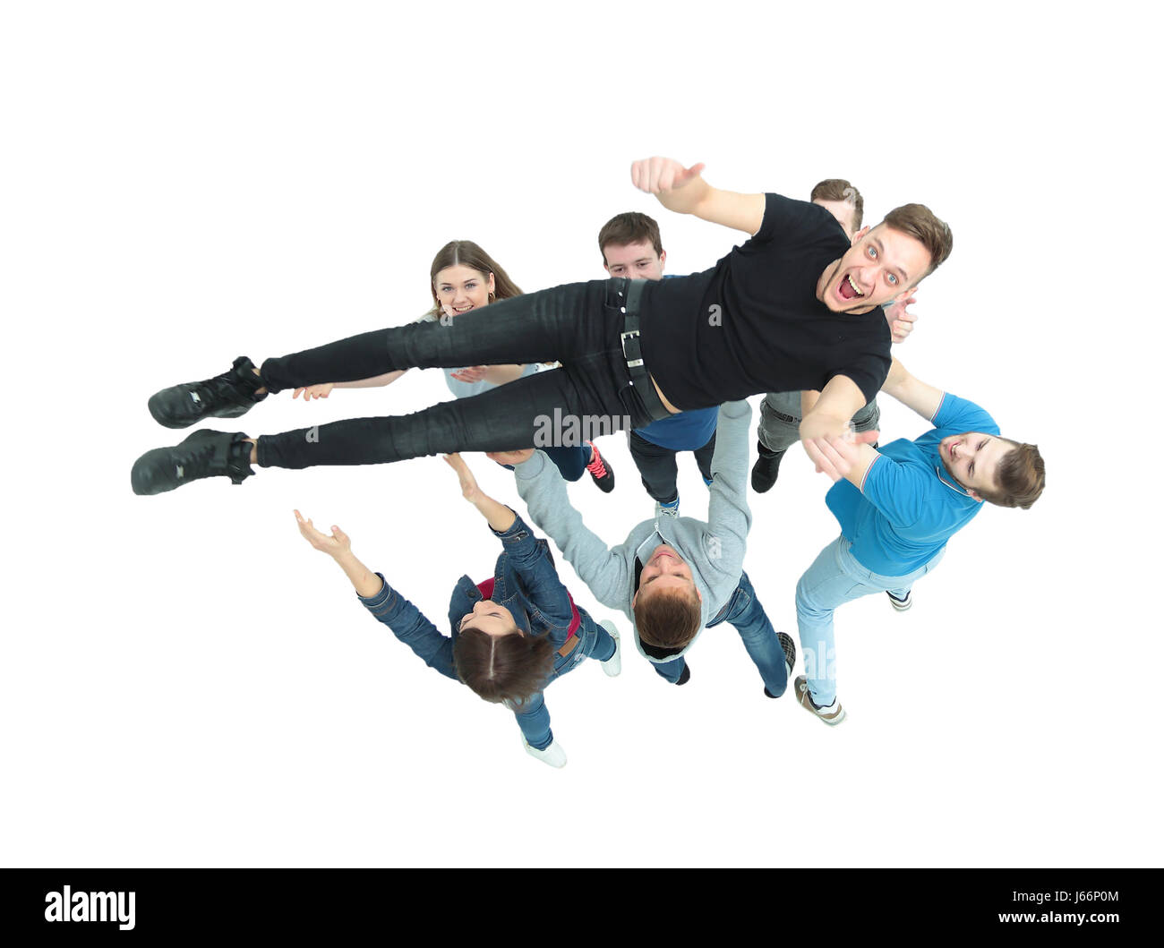 group of young people rocking in the hands of the leader of the team in ...