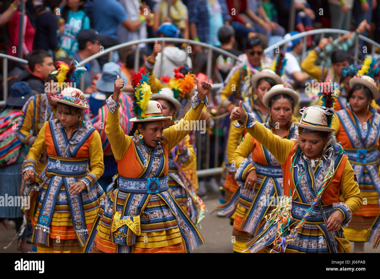 Traditional folk dancers in ornate costumes parading through the mining ...