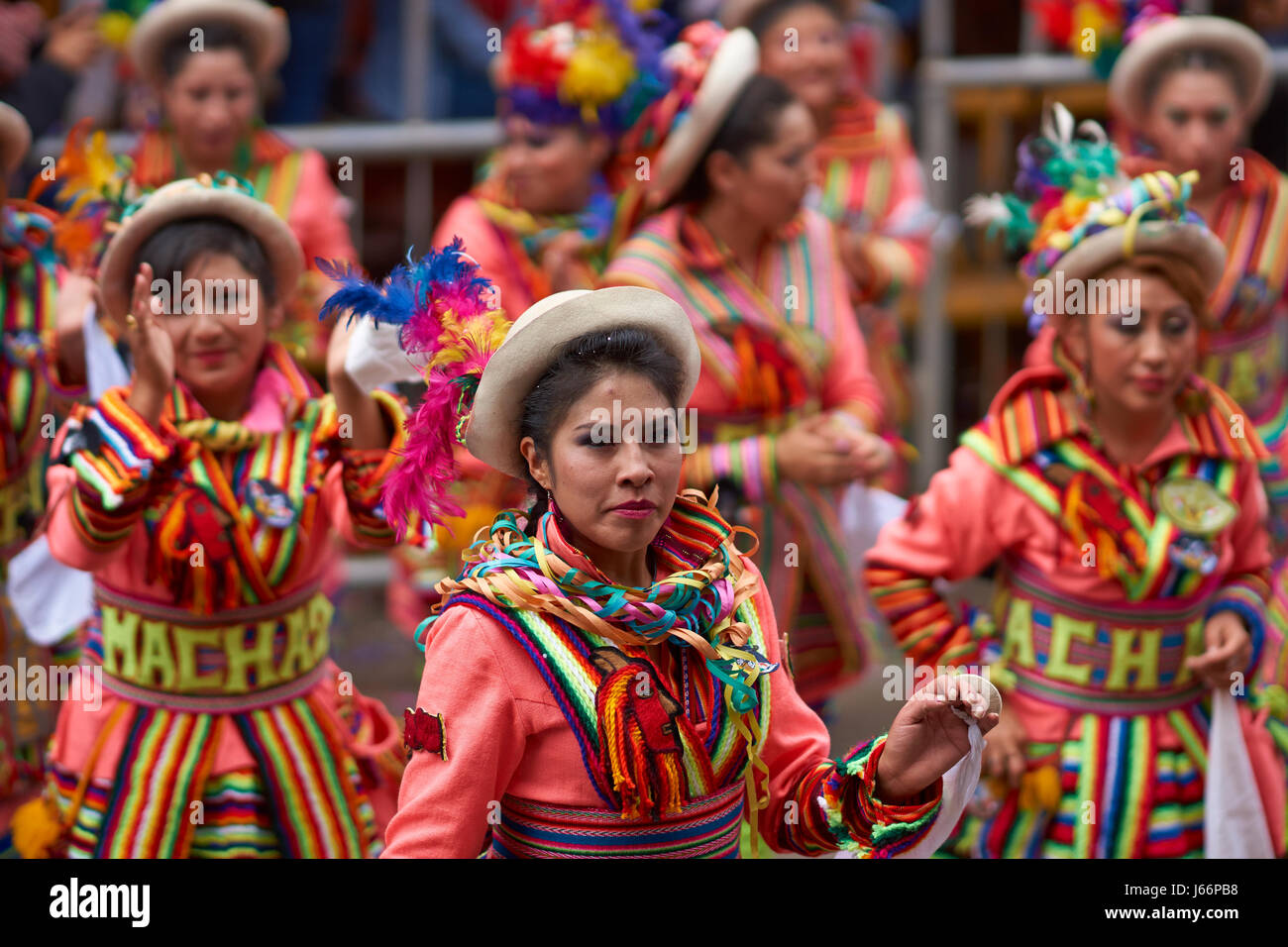 Traditional folk dancers in ornate costumes parading through the mining ...