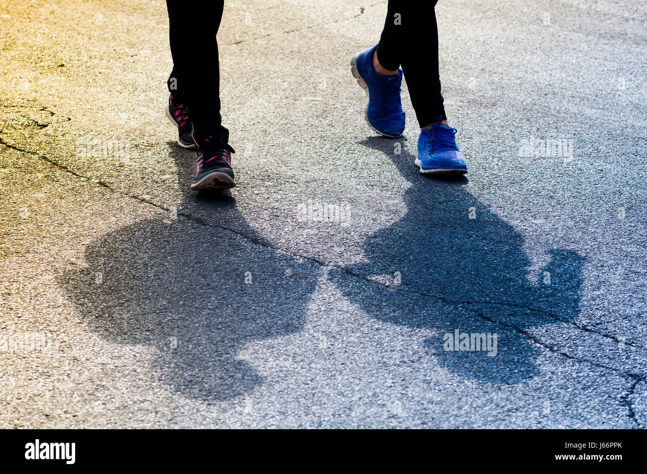 Legs of Runner with Shadow Stock Photo - Alamy