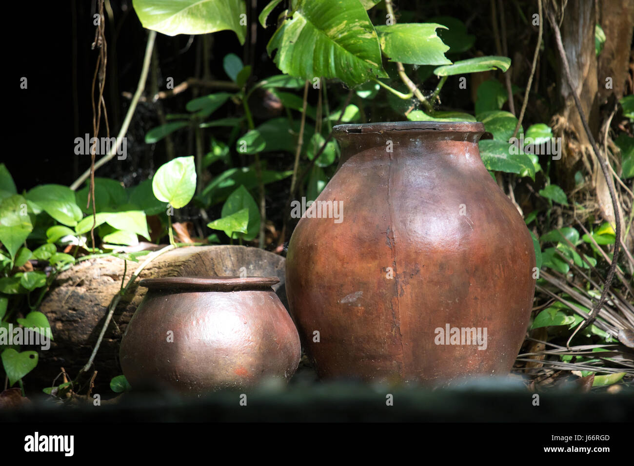 Portrait of two old fashioned clay pots. Tulum, Mexico Stock Photo - Alamy