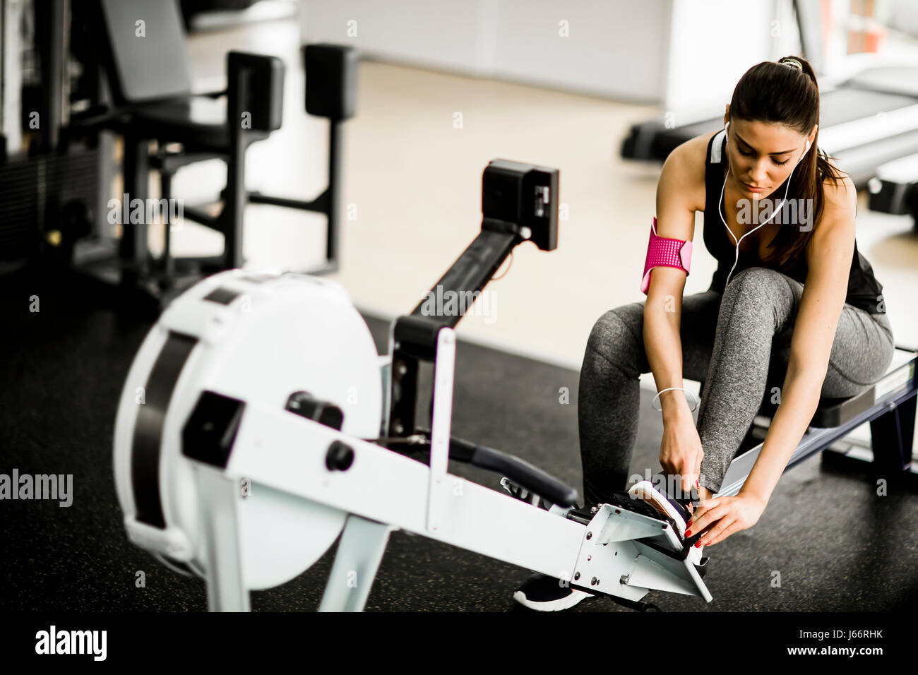 Young woman preparing for workout at the gym Stock Photo - Alamy