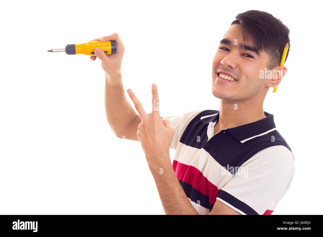 Young man holding a screwdriver Stock Photo - Alamy