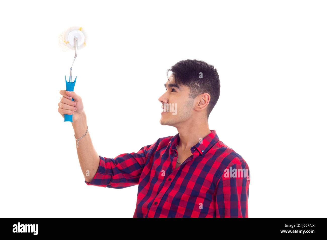 Young man holding a roll Stock Photo - Alamy