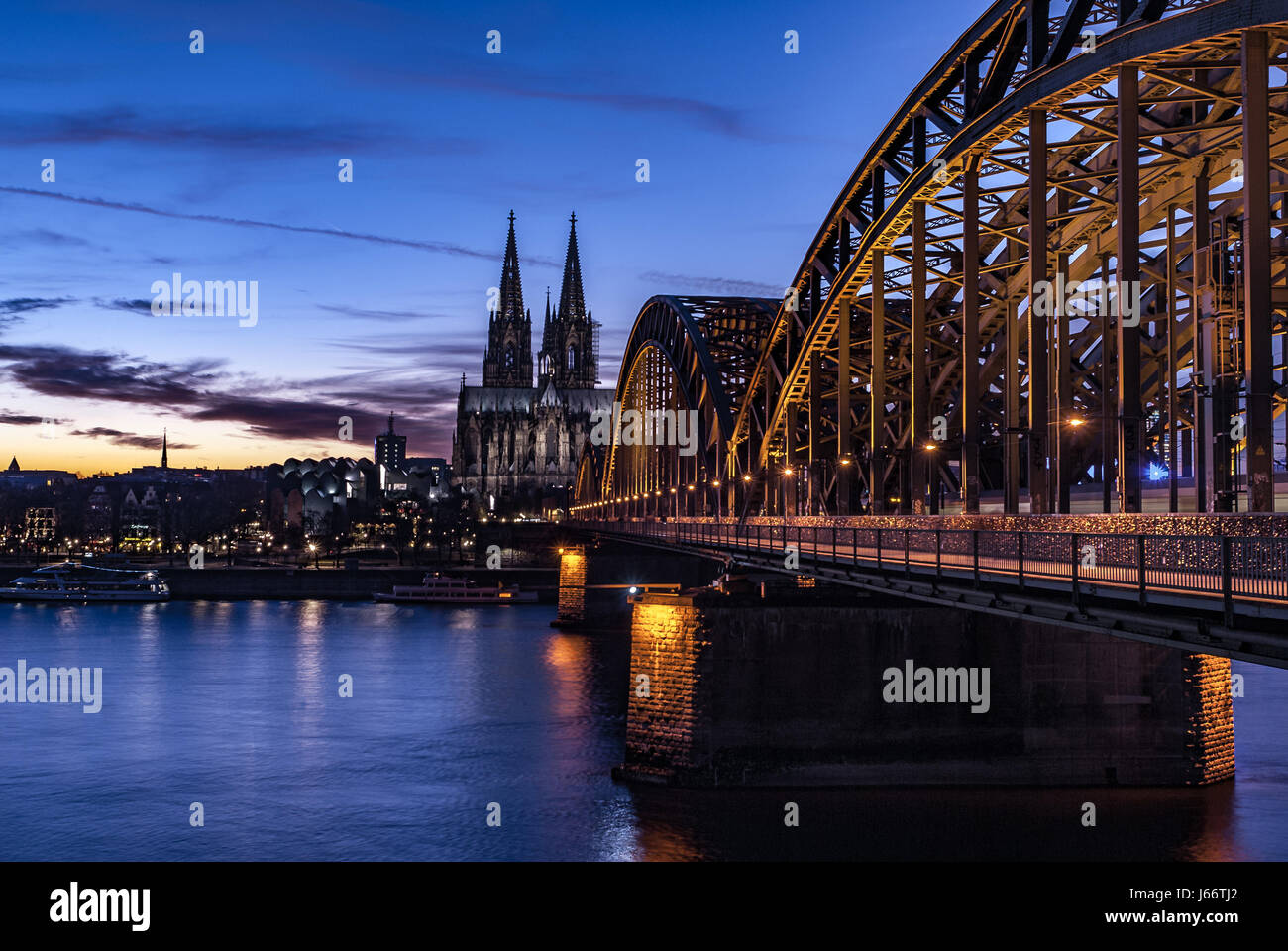 Cologne Cathedral Bridge at Night with the blue Sky Stock Photo - Alamy