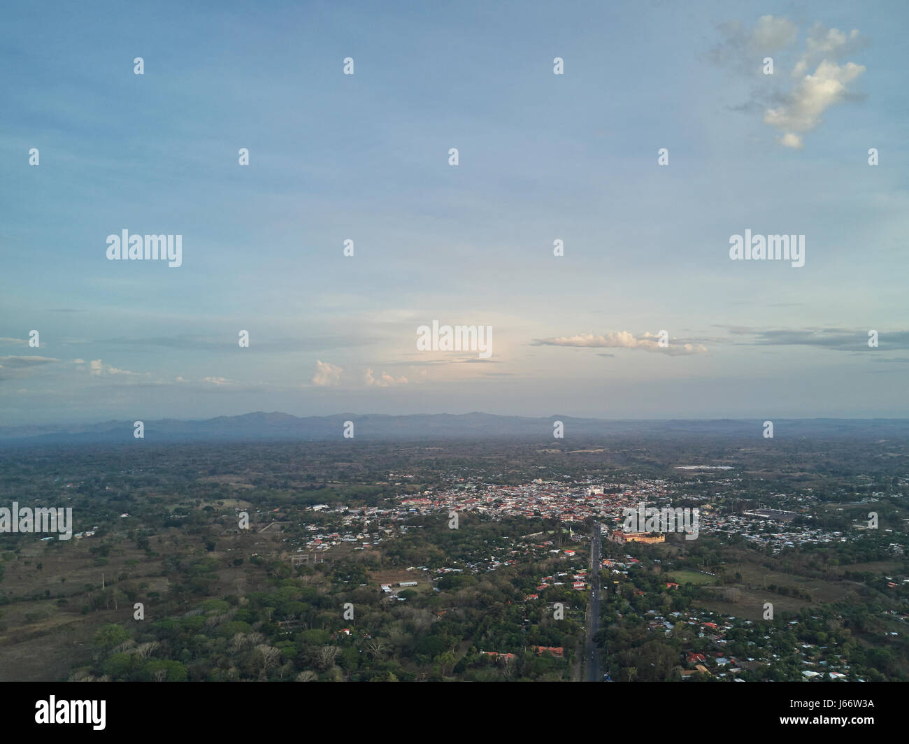 Typical latin small city aerial view. Small town around natural valley ...