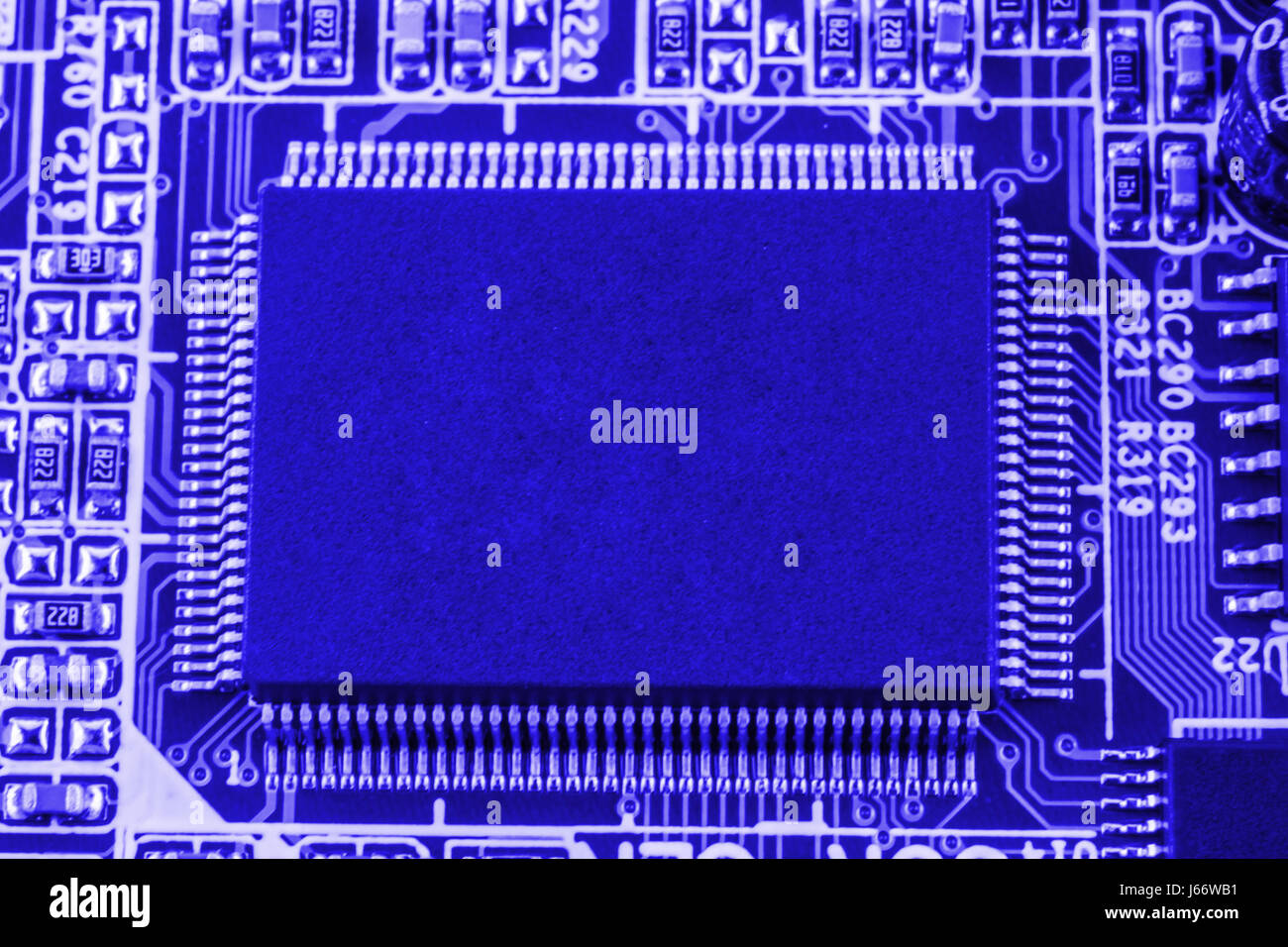 Chip on motherboard mainboard with controllers, ports and wires, close ...