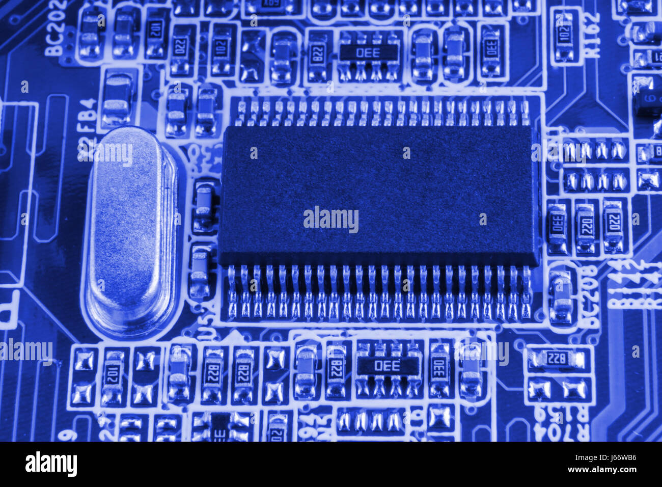 Chip on motherboard mainboard with controllers, ports and wires, close ...