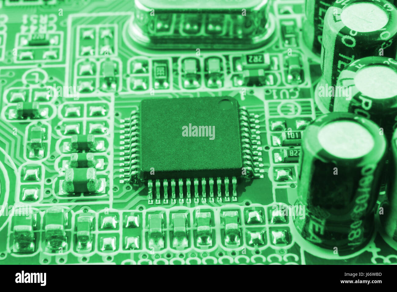 Chip on motherboard mainboard with controllers, ports and wires, close ...