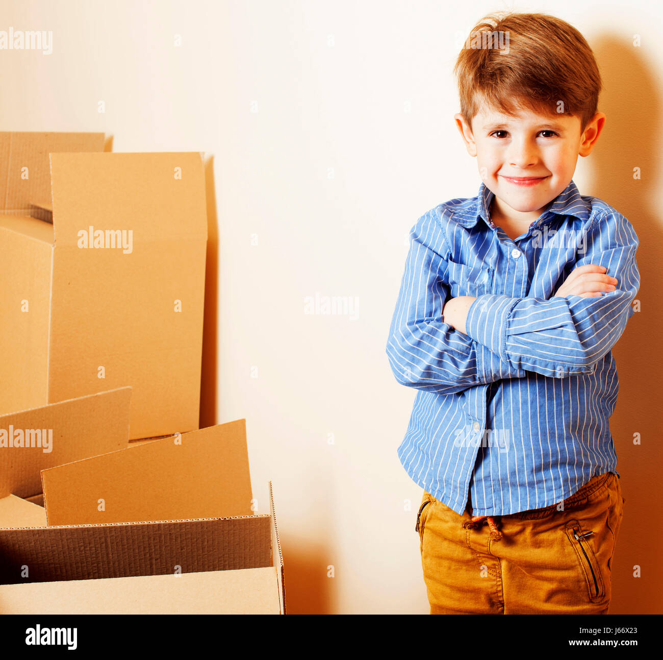 little cute boy in empty room, remoove to new house. home alone ...