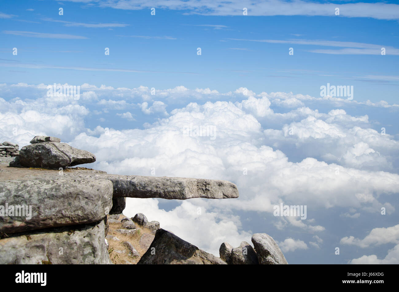 cliff on blue sky background Stock Photo - Alamy