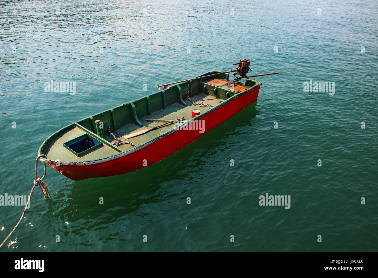 single boat floating on clear water Stock Photo - Alamy