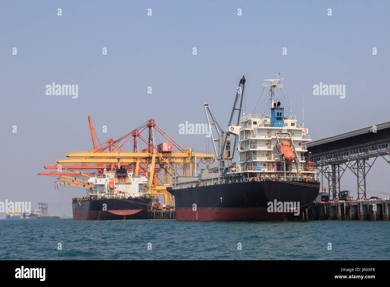 heavy container ship loading goods in commercial sea import export ...