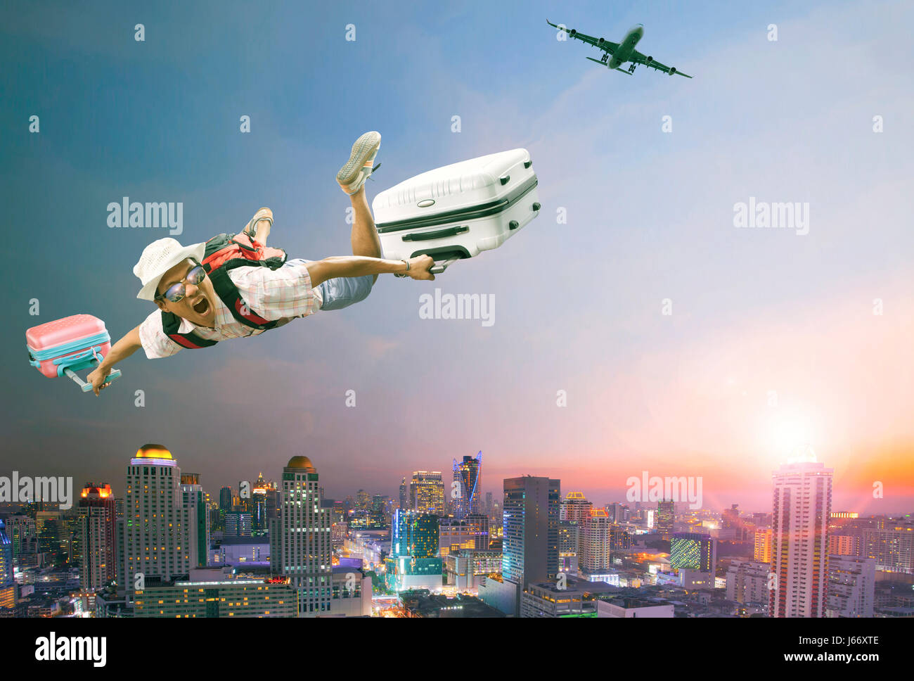younger man flying mid air with belonging luggage and passenger plane ...