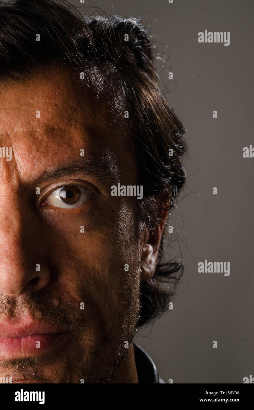 Half face portrait of a hispanic male Stock Photo - Alamy