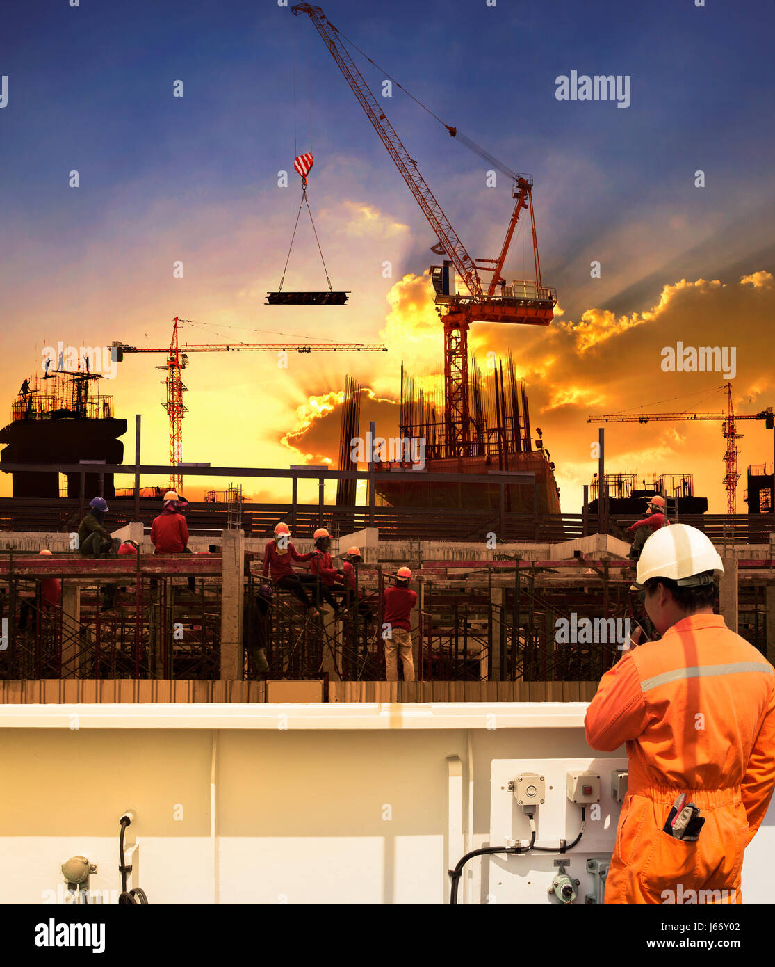 contractor and construction worker working in building construction ...