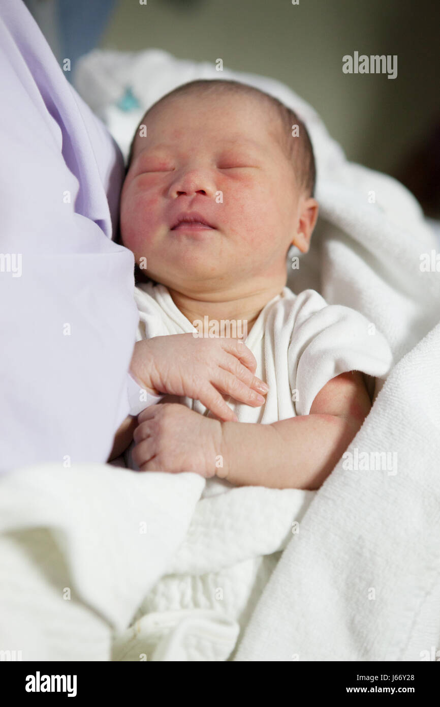 face of asleep new born baby in delivery room Stock Photo - Alamy