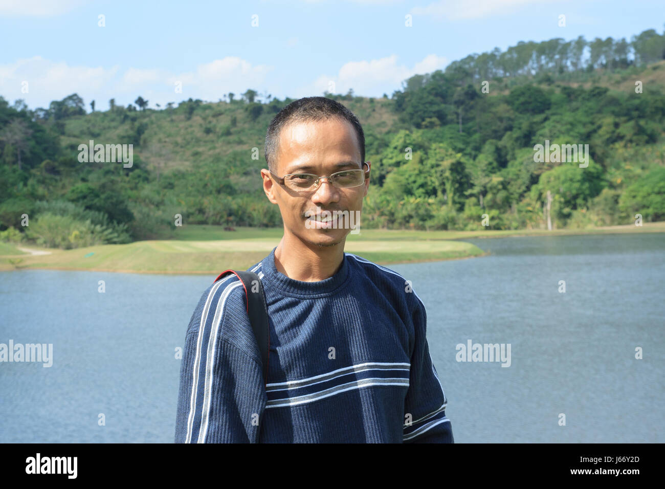 thin asian man wearing eyes glass with skin head hair fashion smiling ...