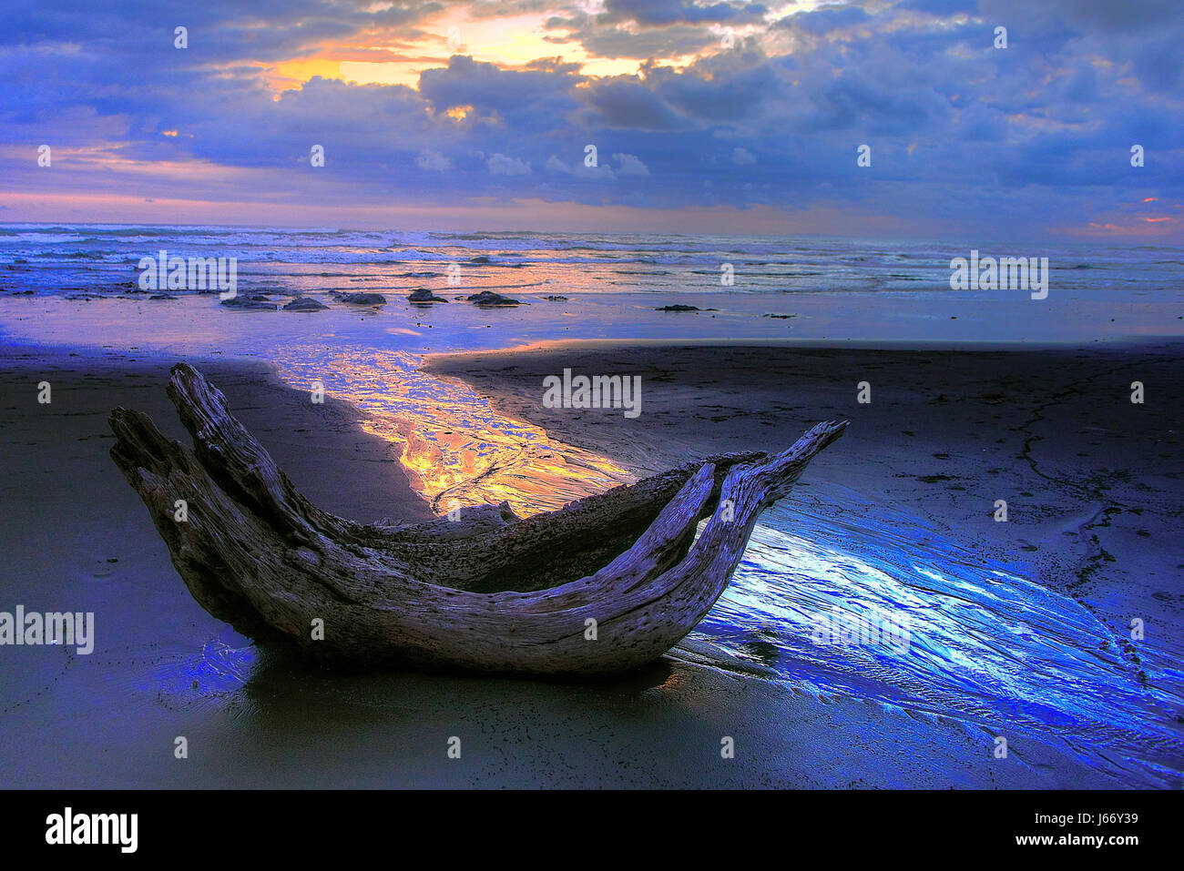 Beach sunset with blue sky Stock Photo - Alamy