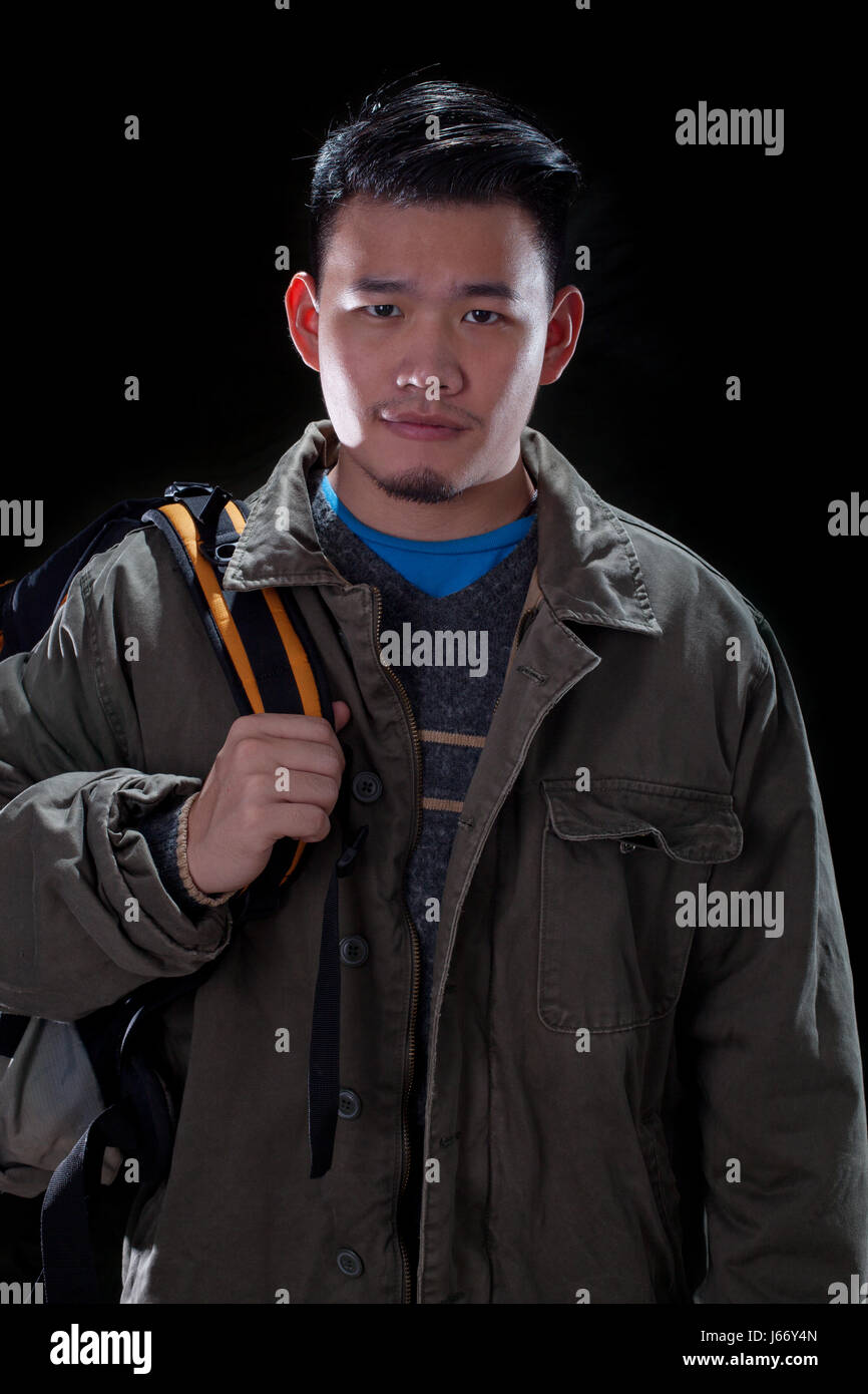 Man carrying back pack hi-res stock photography and images - Alamy