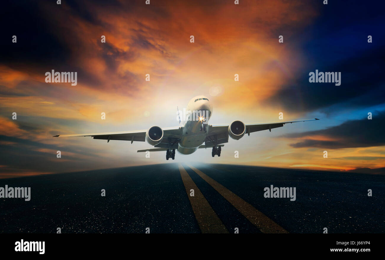 passenger plane take off from runways against beautiful dusky sky with ...