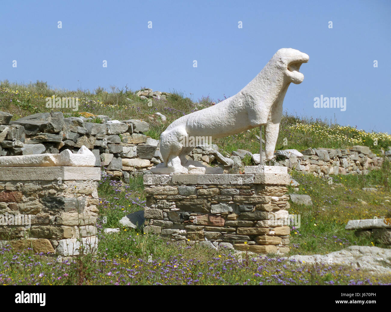 Ancient lion statue against the sunny sky, Archaeological Site of Delos ...