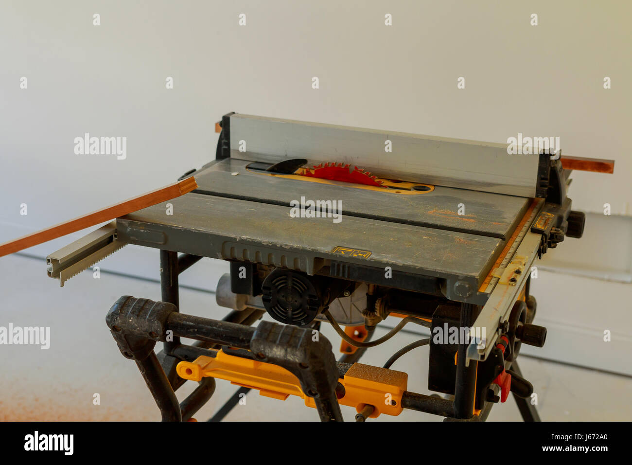 carpenter use ruler to measuring wood board Circular saw cutting wooden ...