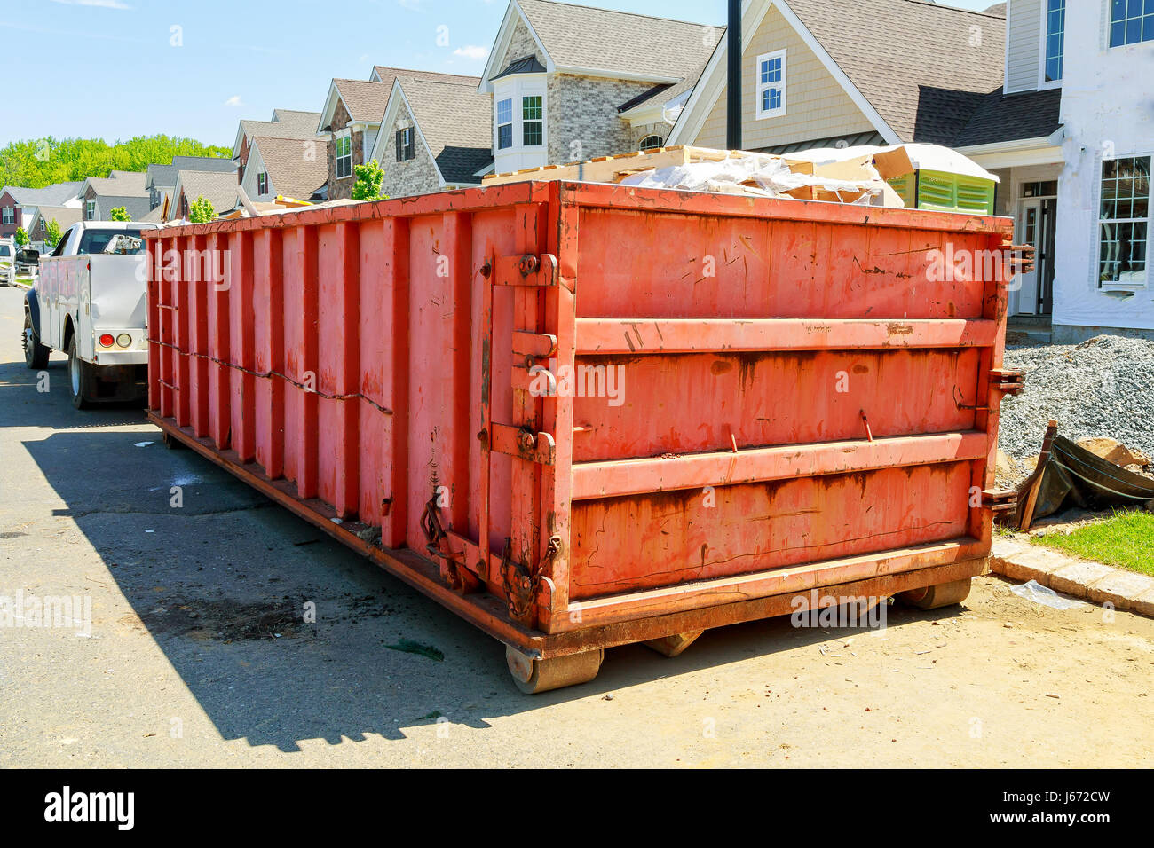 garbage containers near the new home, Red containers, recycling and ...