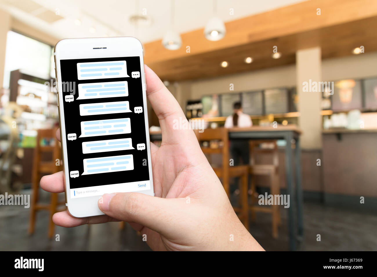 Chat bot and future marketing concept . Hand holding mobile phone with ...