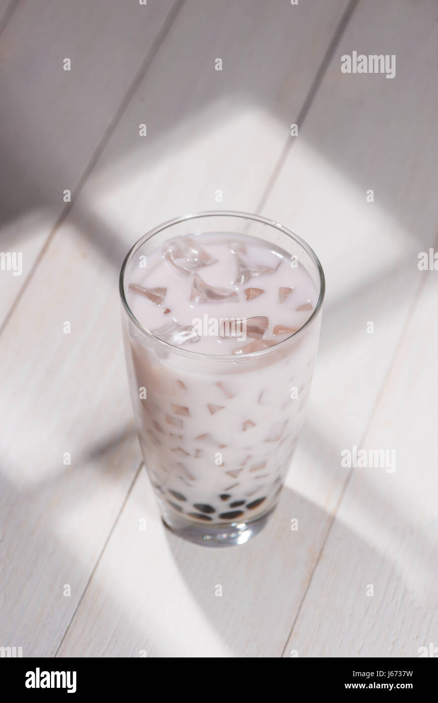 Boba / Bubble tea. Homemade Taro Milk Tea with Pearls on wooden table ...
