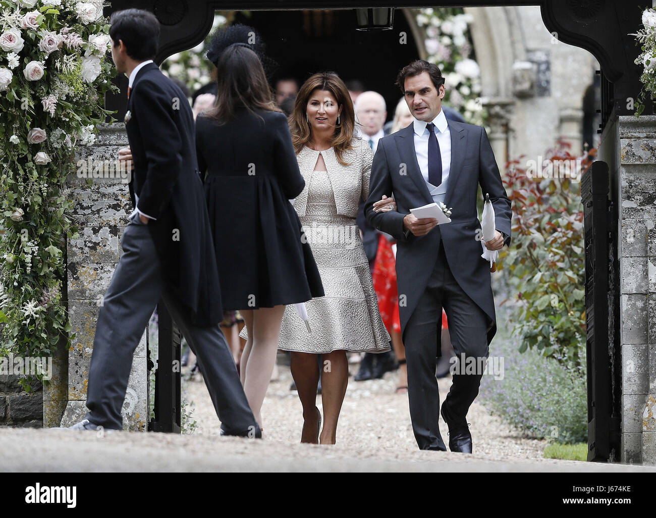 Roger Federer and his wife Mirka leave St Mark's church in Englefield ...