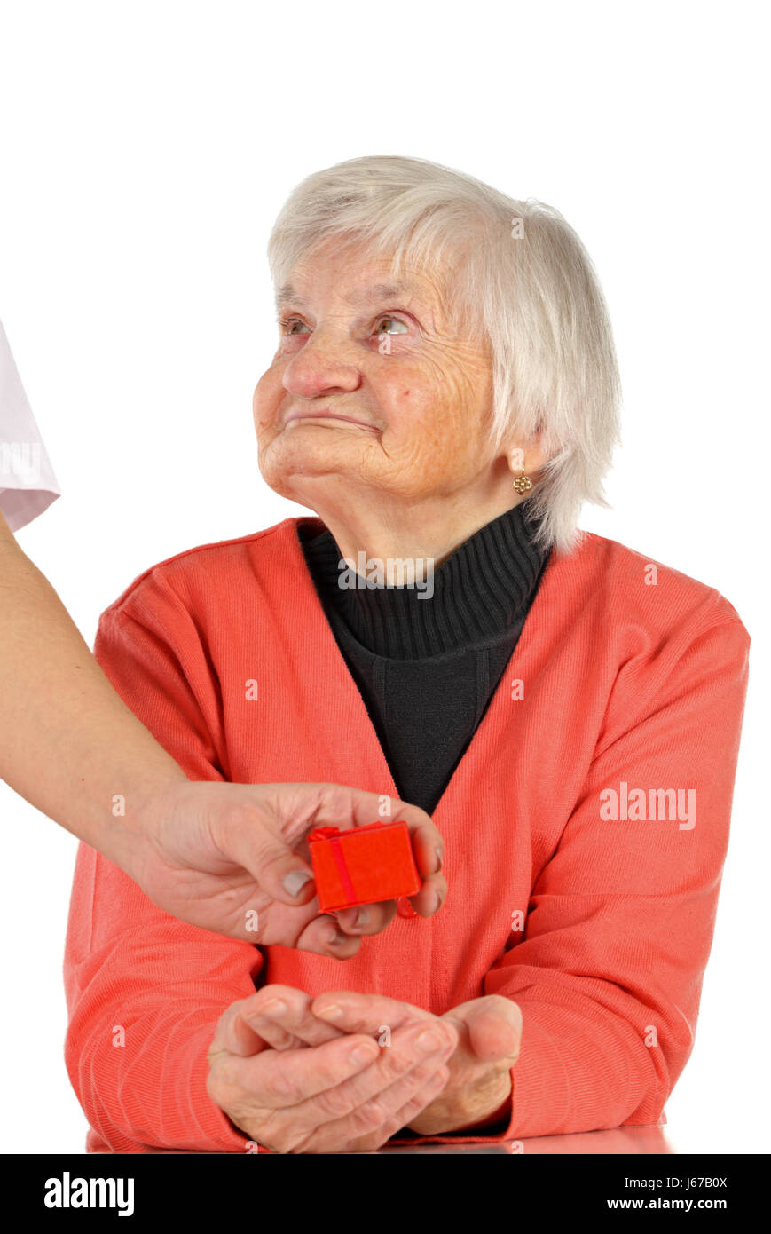Happy senior woman waiting for her present Stock Photo - Alamy