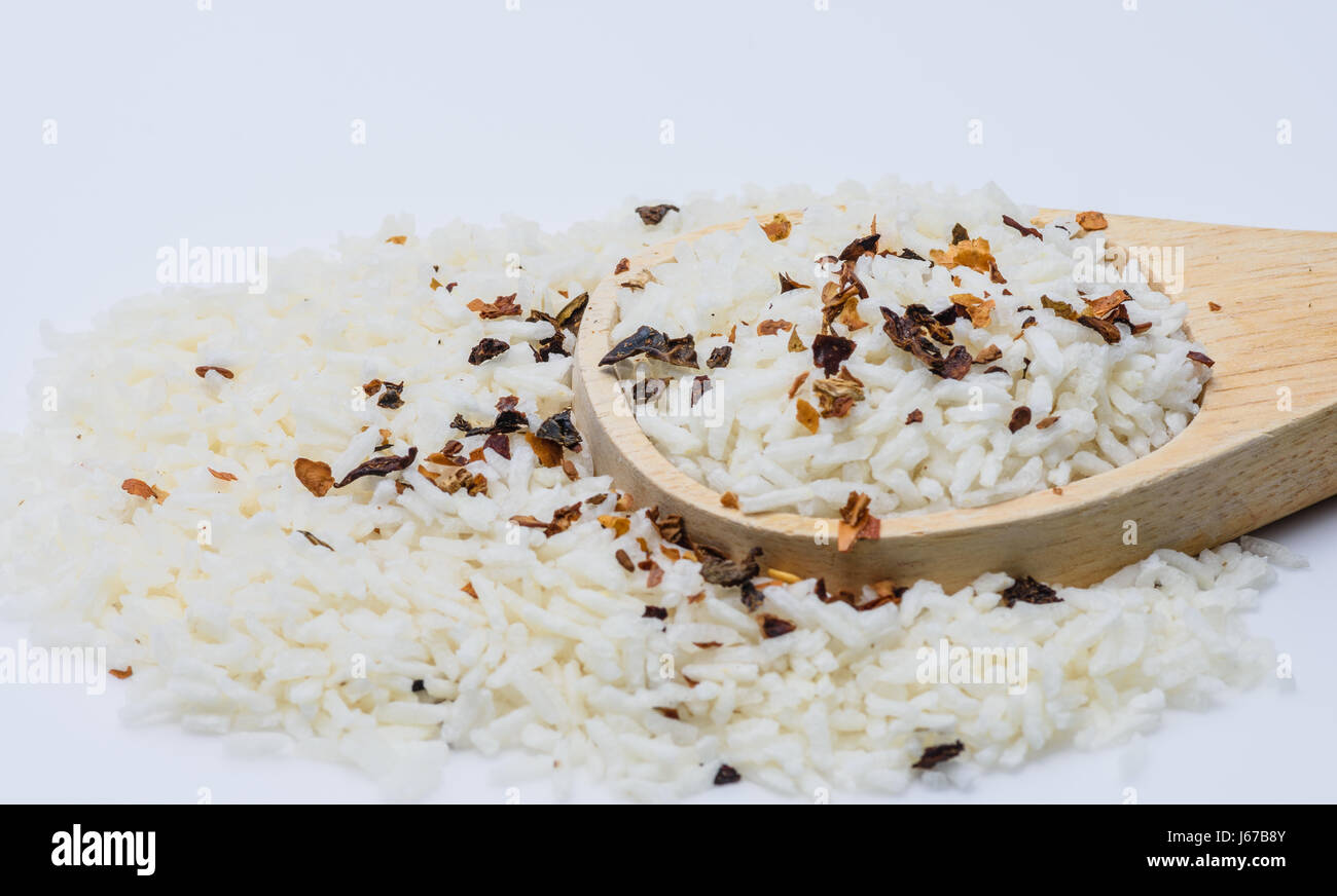 Rice and spice on wooden spoon Stock Photo - Alamy
