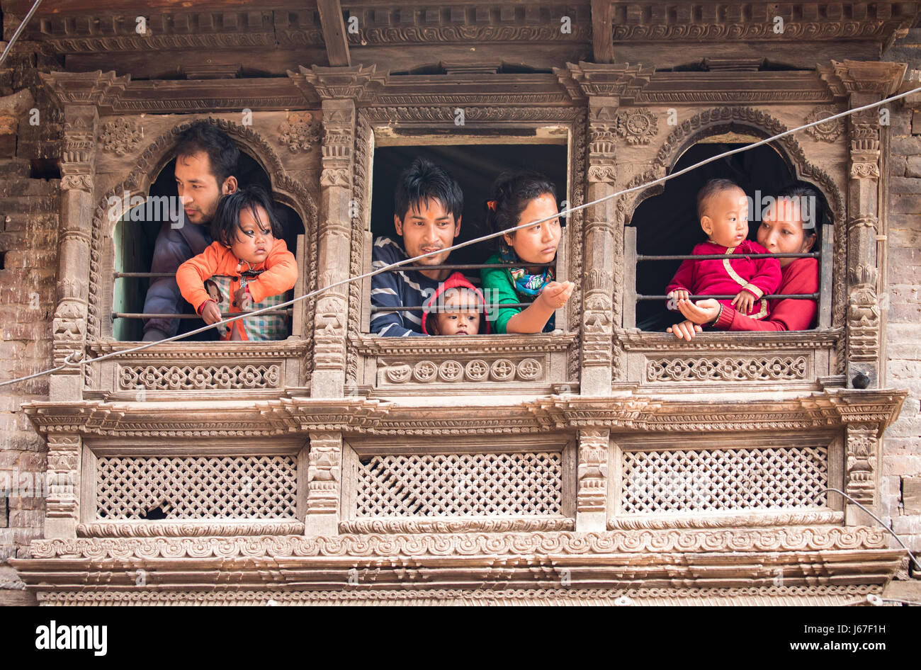 Kathmandu, Nepal - Apr 15, 2016: Father and his child watching passing ...