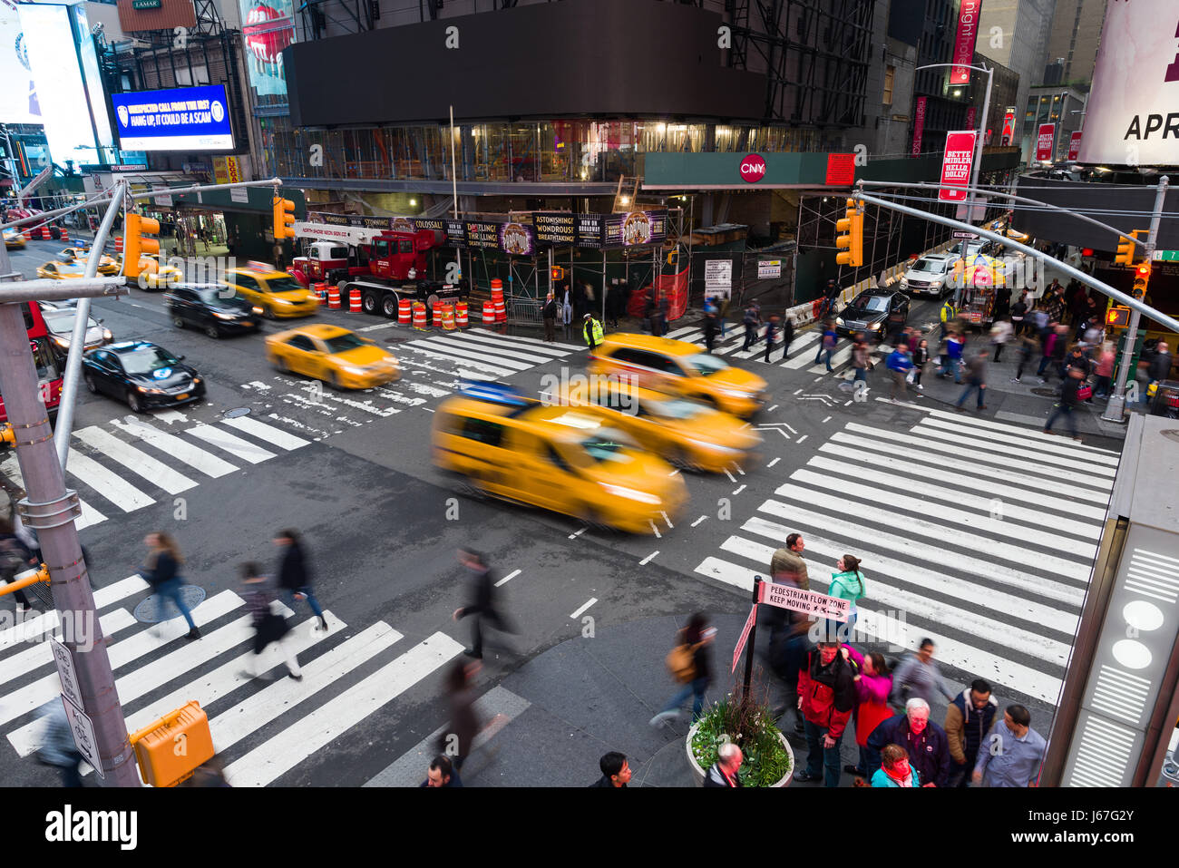 Yellow Taxi Cabs Driving Through Times Square Crossroads With ...