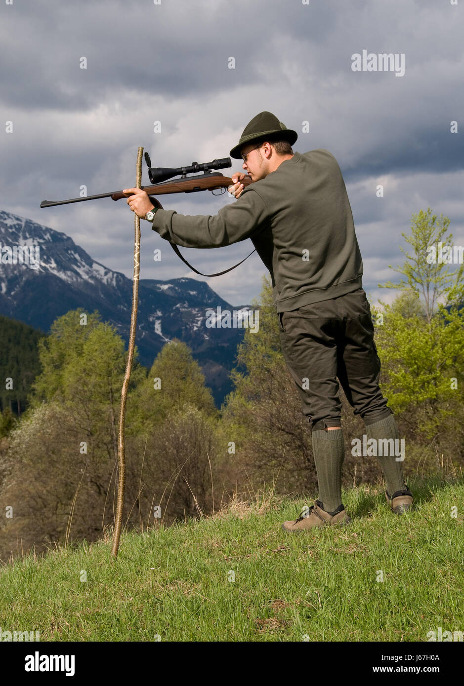 hunter apply rifle arm weapon ready to fire hunting chase tree trees ...