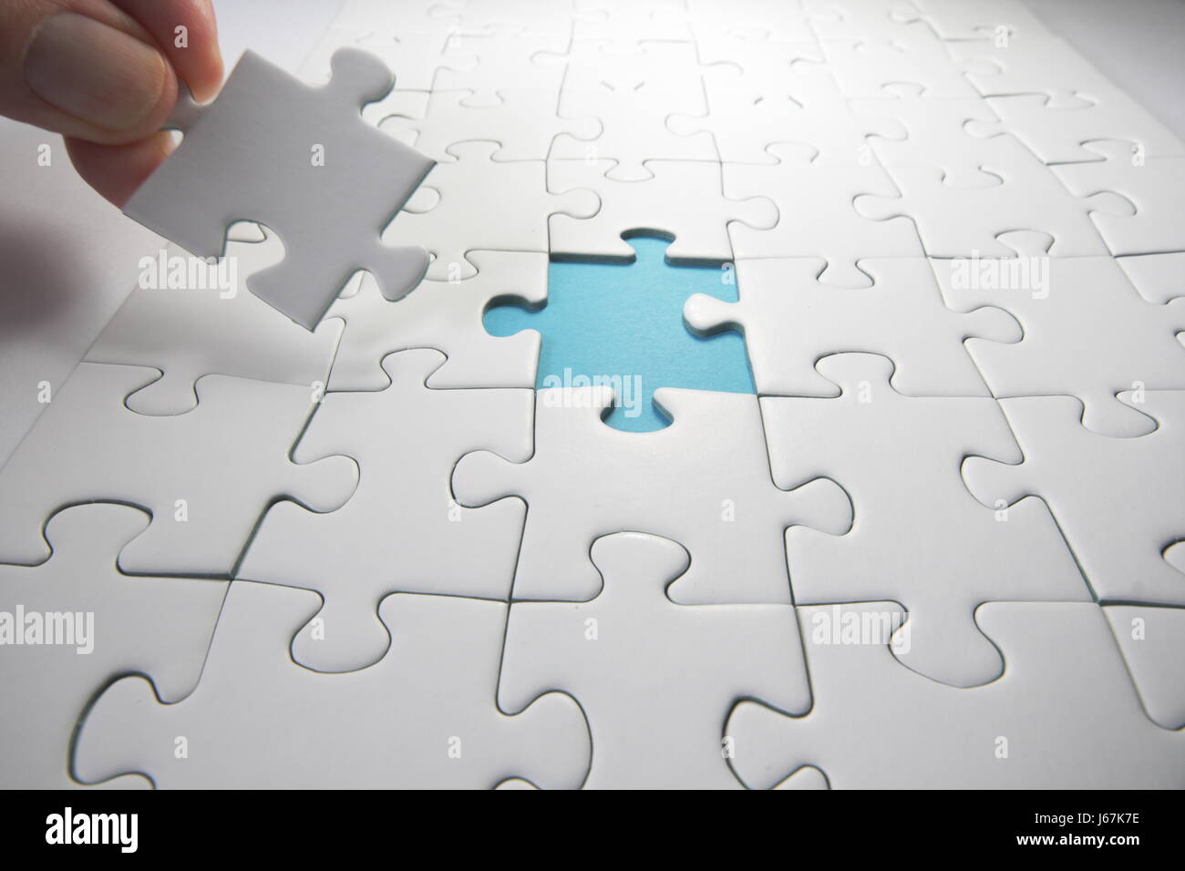 Teamwork symbolized by jigsaw-puzzle Stock Photo - Alamy