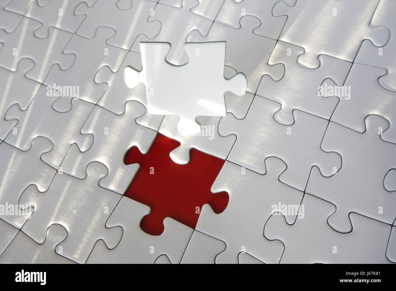 Teamwork symbolized by jigsaw-puzzle Stock Photo - Alamy