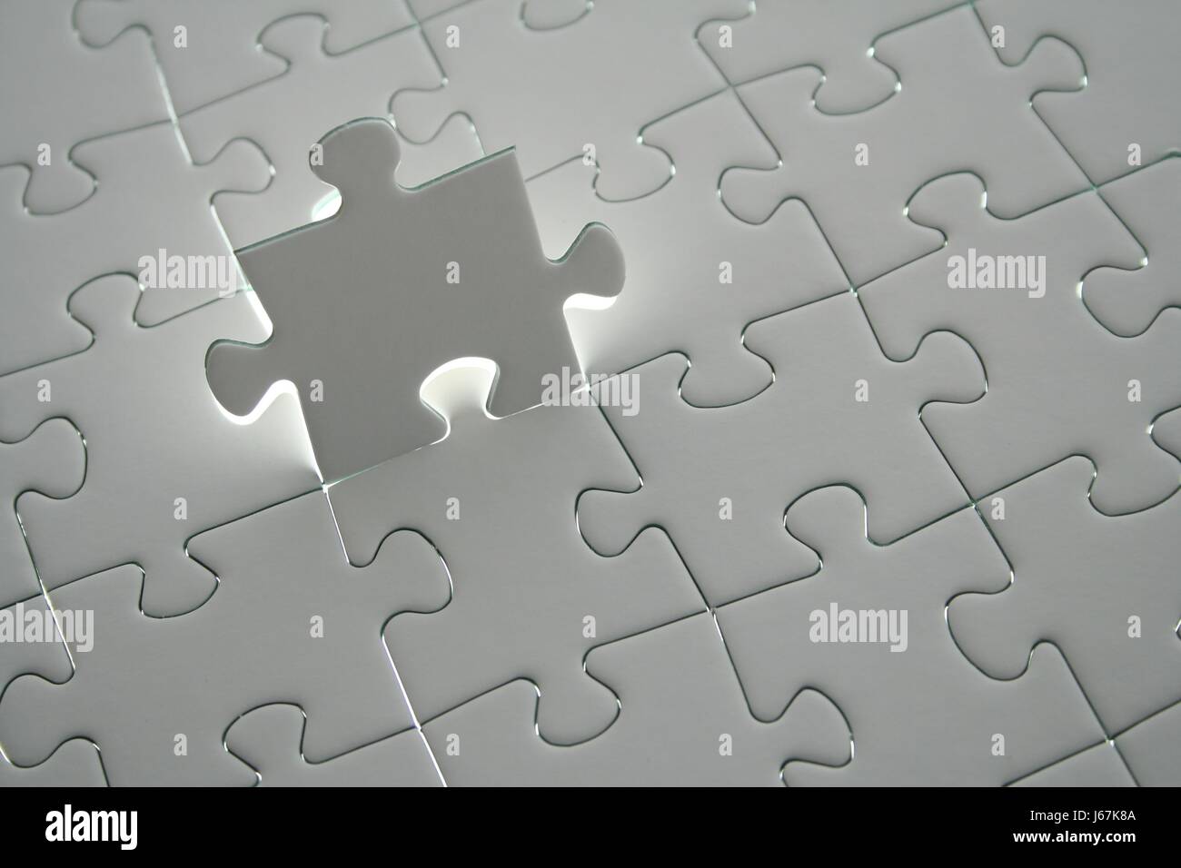 Teamwork symbolized by jigsaw-puzzle Stock Photo - Alamy