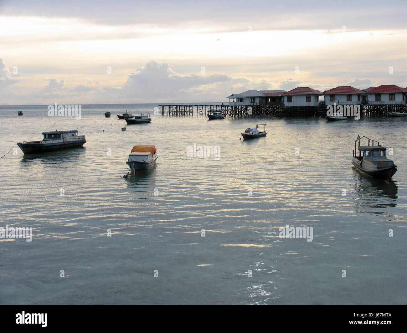indonesia borneo stakes huts salt water sea ocean water isle island ...