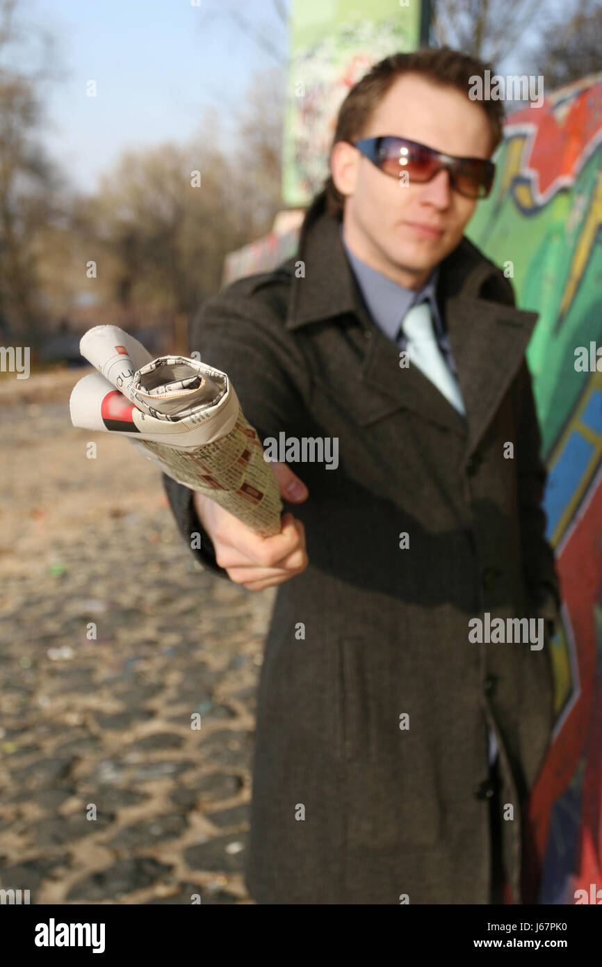 man showing the newspaper Stock Photo - Alamy