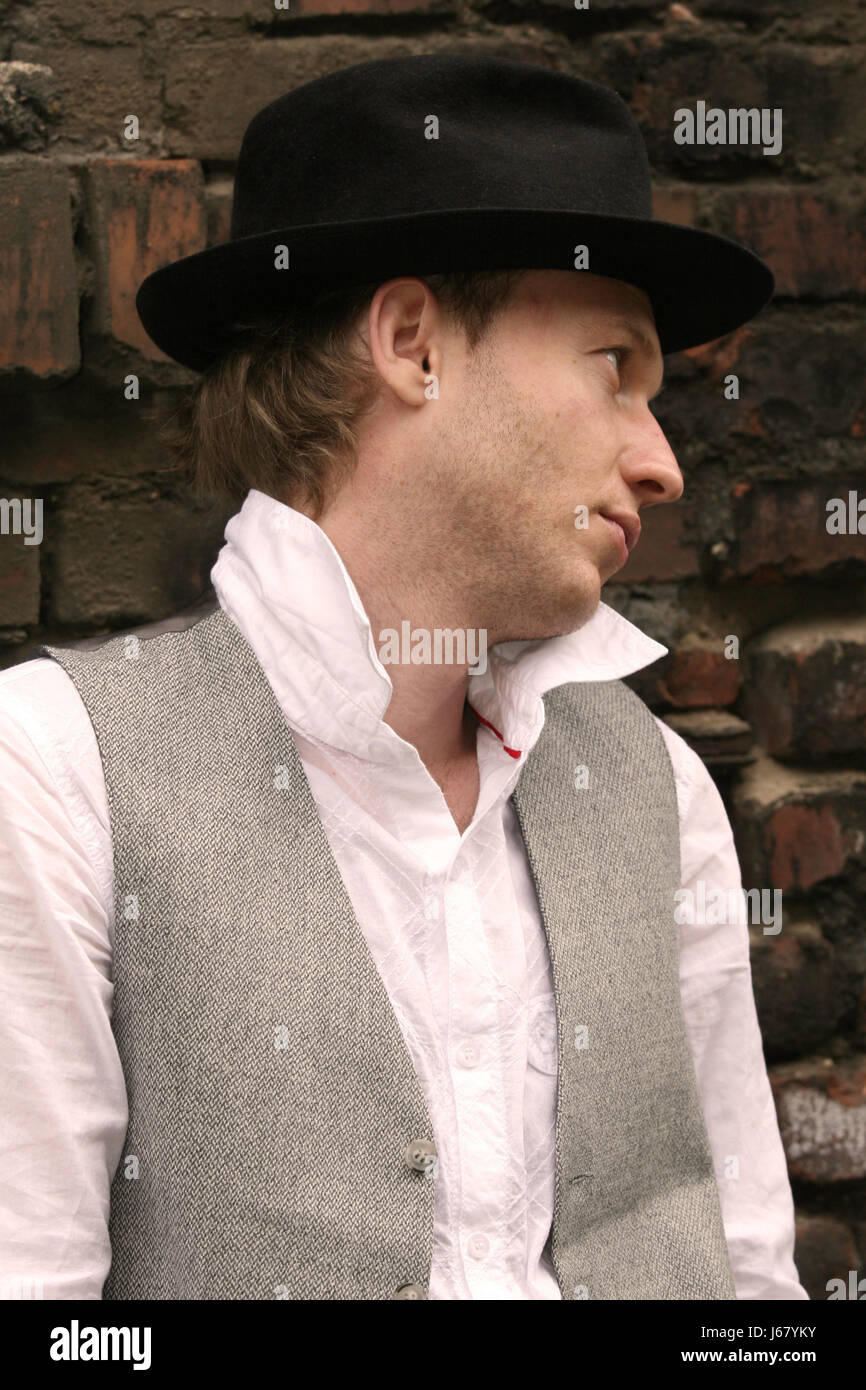 profile hat sad man fashion male masculine hat sad wall outdoor brick ...