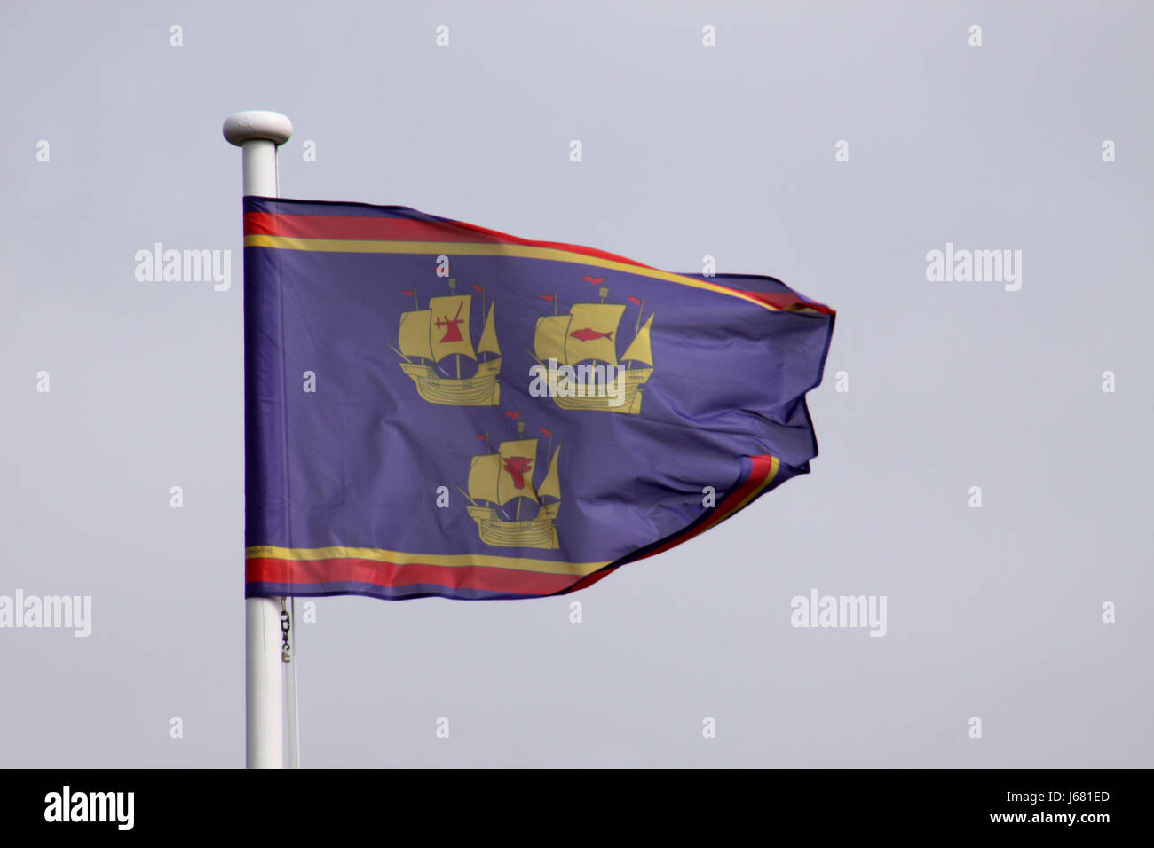 frisian flag with 3 cogs Stock Photo - Alamy