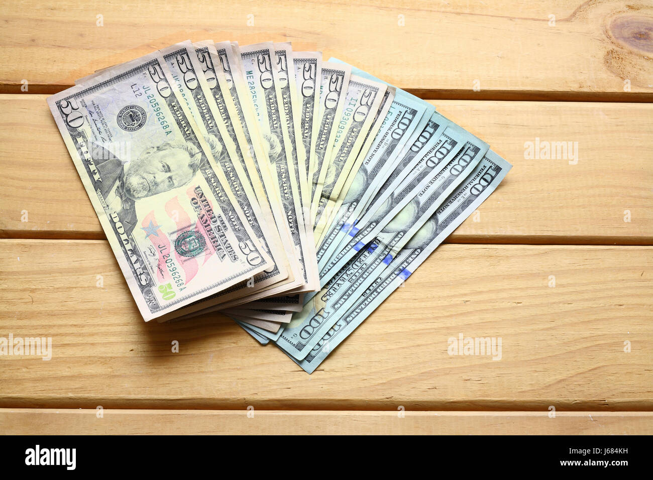 Bank Notes on Wooden Background Stock Photo - Alamy