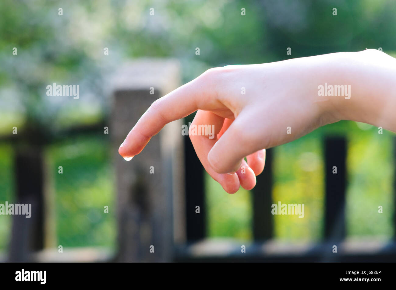 children hand with drops Stock Photo - Alamy