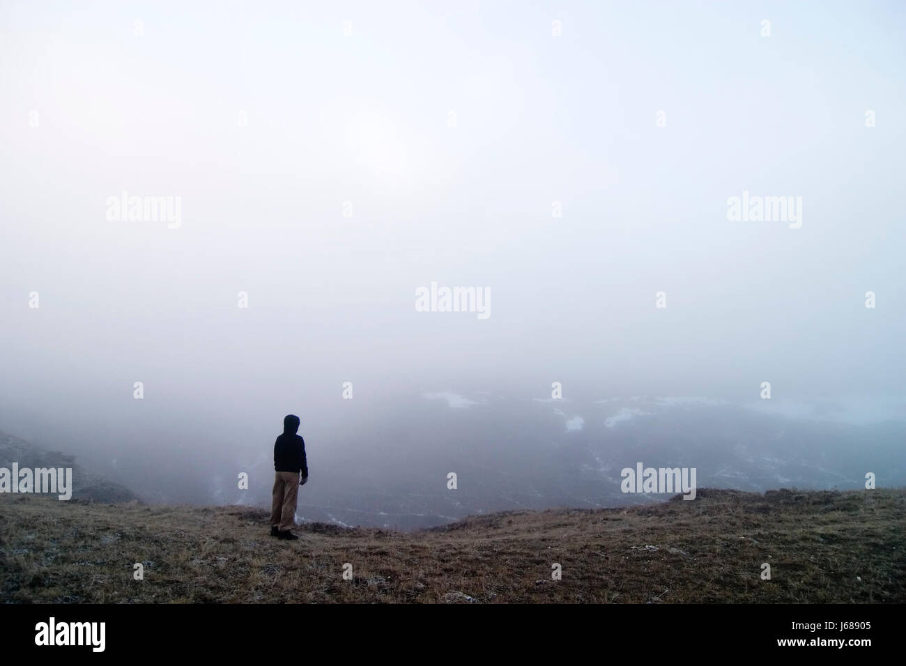 woman walk go going walking female winter male masculine cloud snow ...