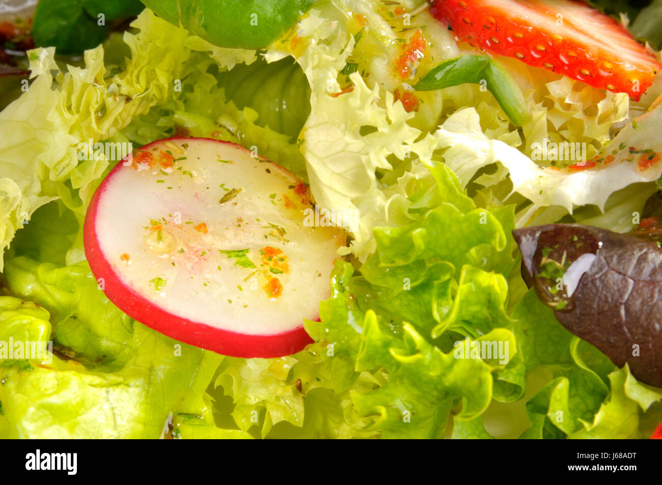 salad with fresh dressing Stock Photo - Alamy